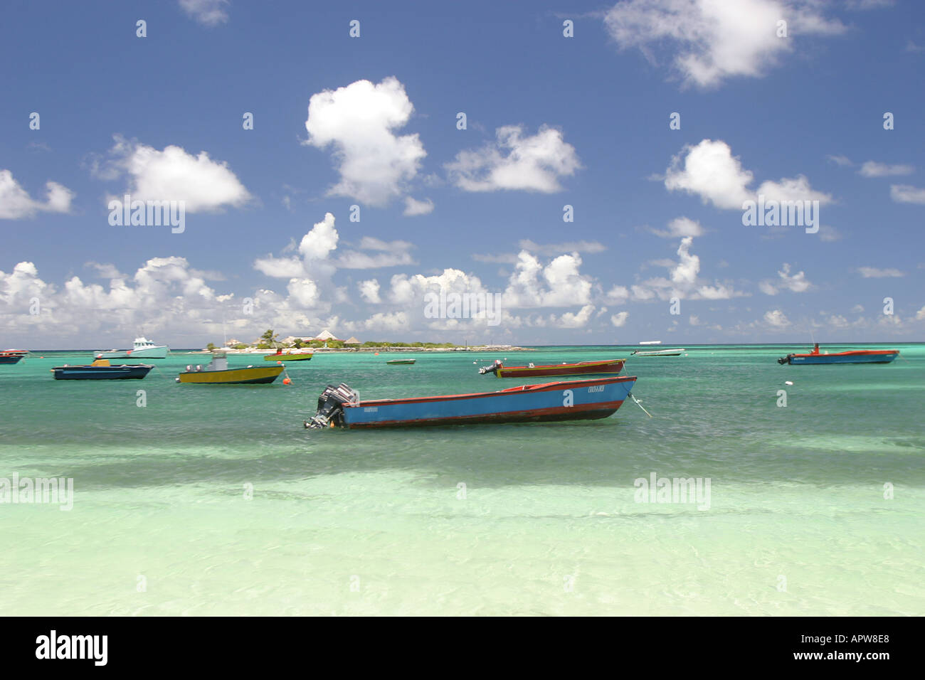 Fishing boats floating off the beach in Island Harbour off the island ...
