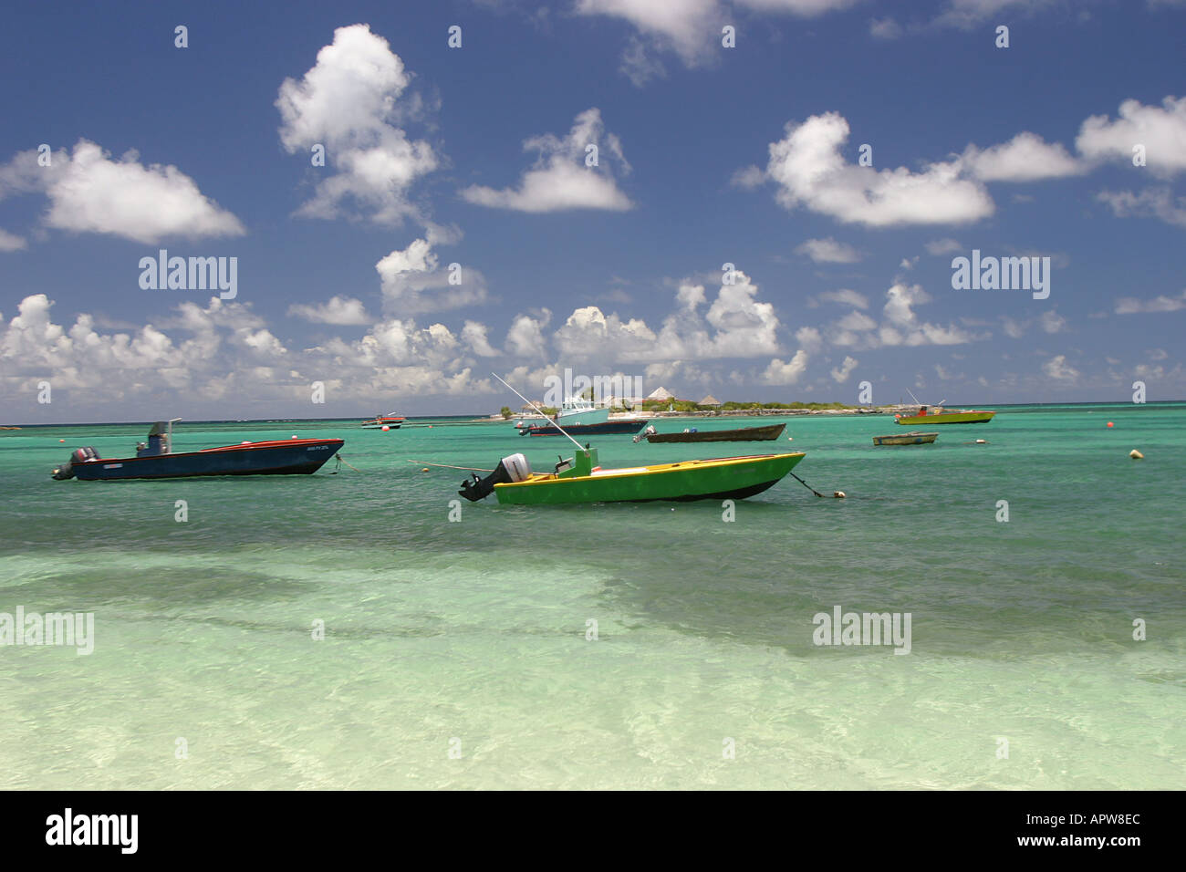 Fishing boats floating off the beach in Island Harbour off the island ...