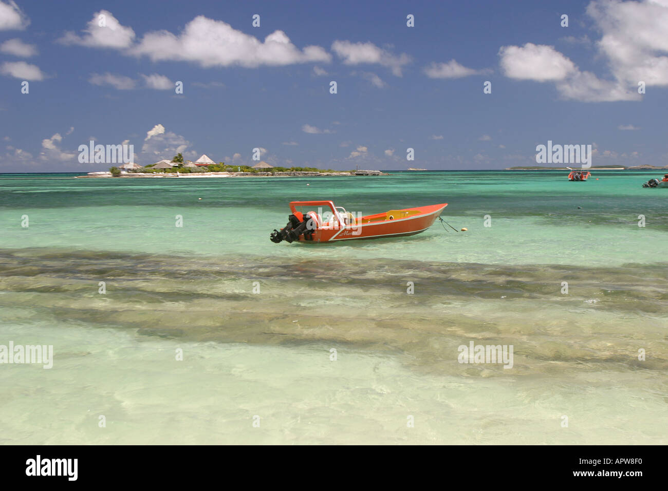 Fishing boats floating off the beach in Island Harbour off the island ...