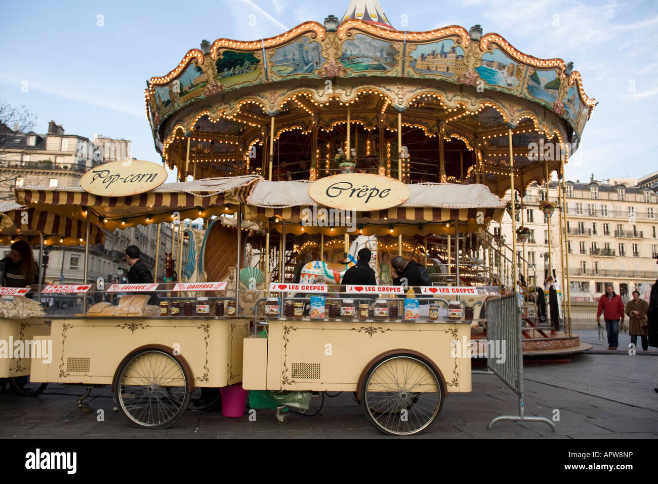French classic carousel attraction in front at the Hotel de Ville ...