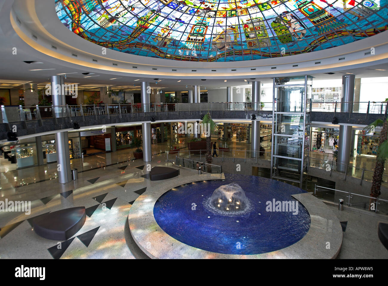Stained glass dome and decorative pool Kukulcan Plaza upmarket shopping ...
