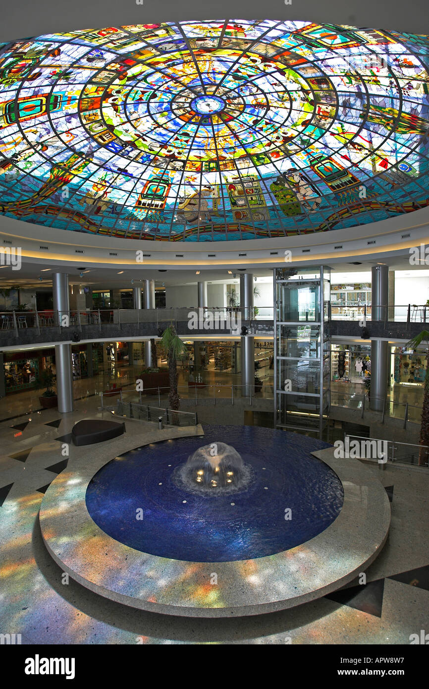 Stained glass dome and decorative pool Kukulcan Plaza upmarket shopping ...
