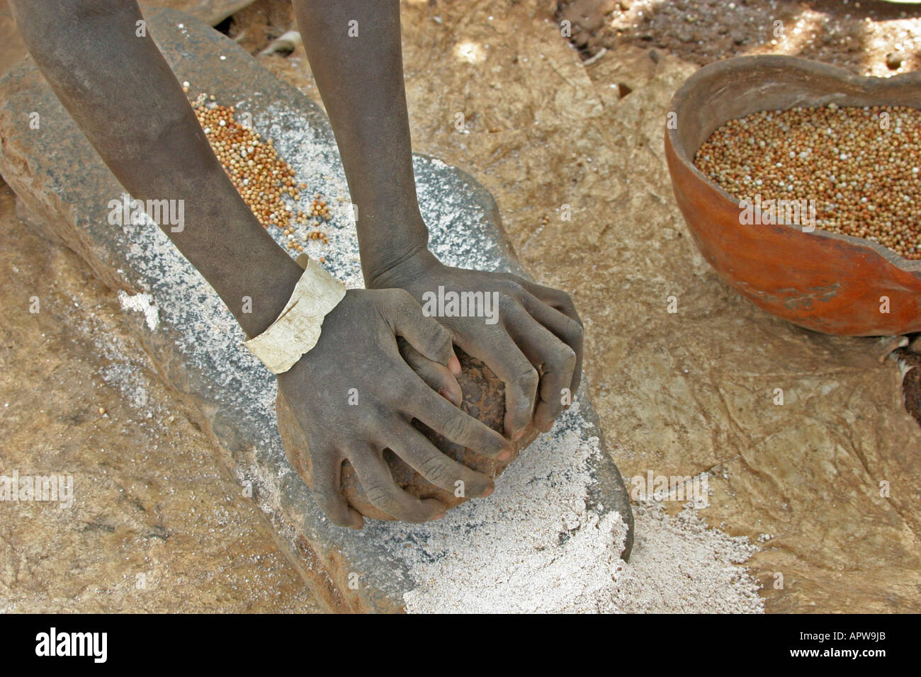 Grinding stone tribe hi-res stock photography and images - Alamy