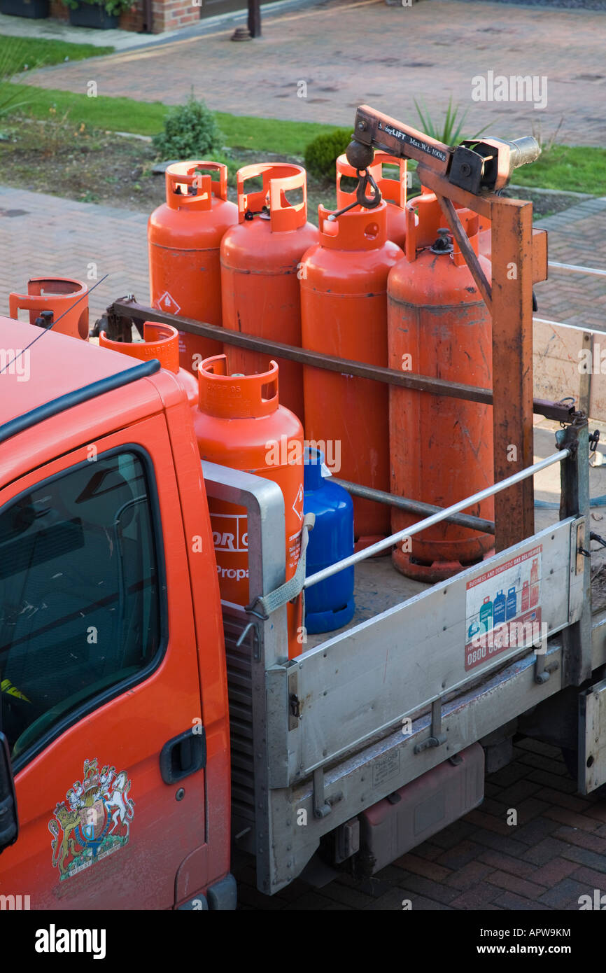 UK Red domestic propane Calor Gas cylinders being delivered on truck ...