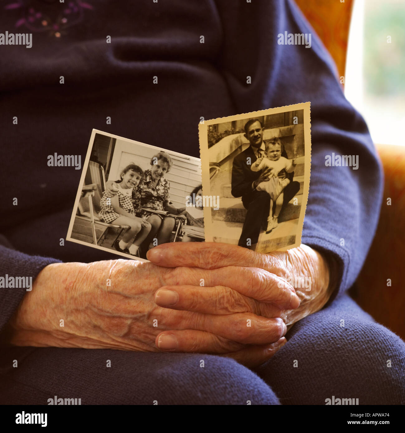 old lady holding photographs Stock Photo - Alamy