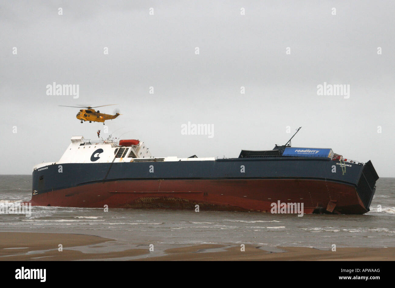 RAF rescue helicopter winches up a member of the recovery team onto ...