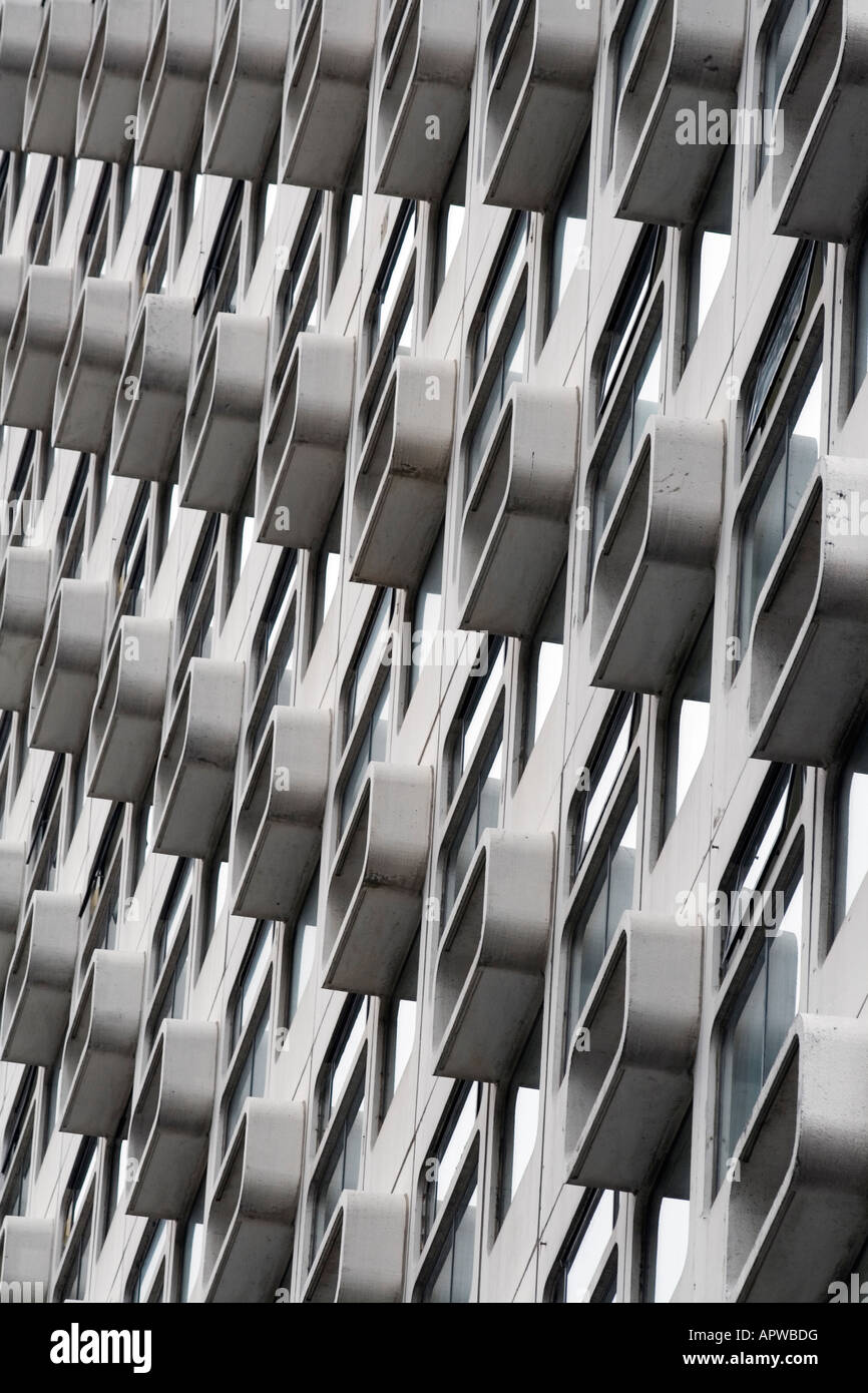 Repeating pattern of windows on the side of a 70 s tower block ...