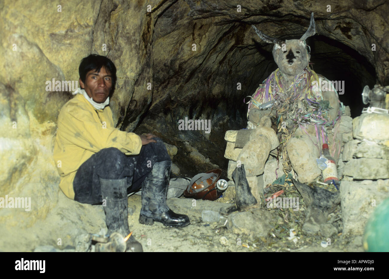 Miner bringing offerings to the mine god El Tio. Cerro Rico Potosi ...