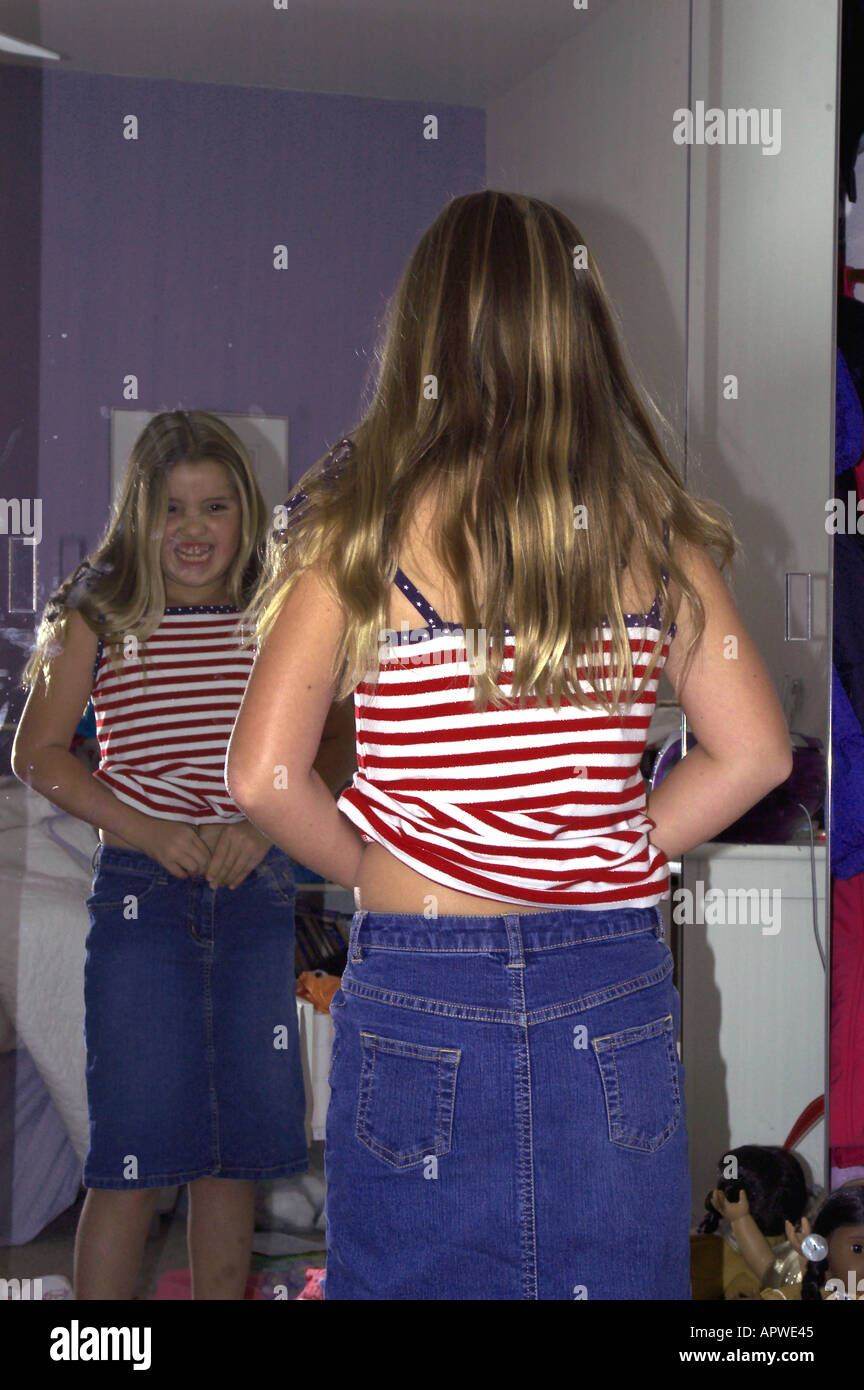 Woman Putting On Dress