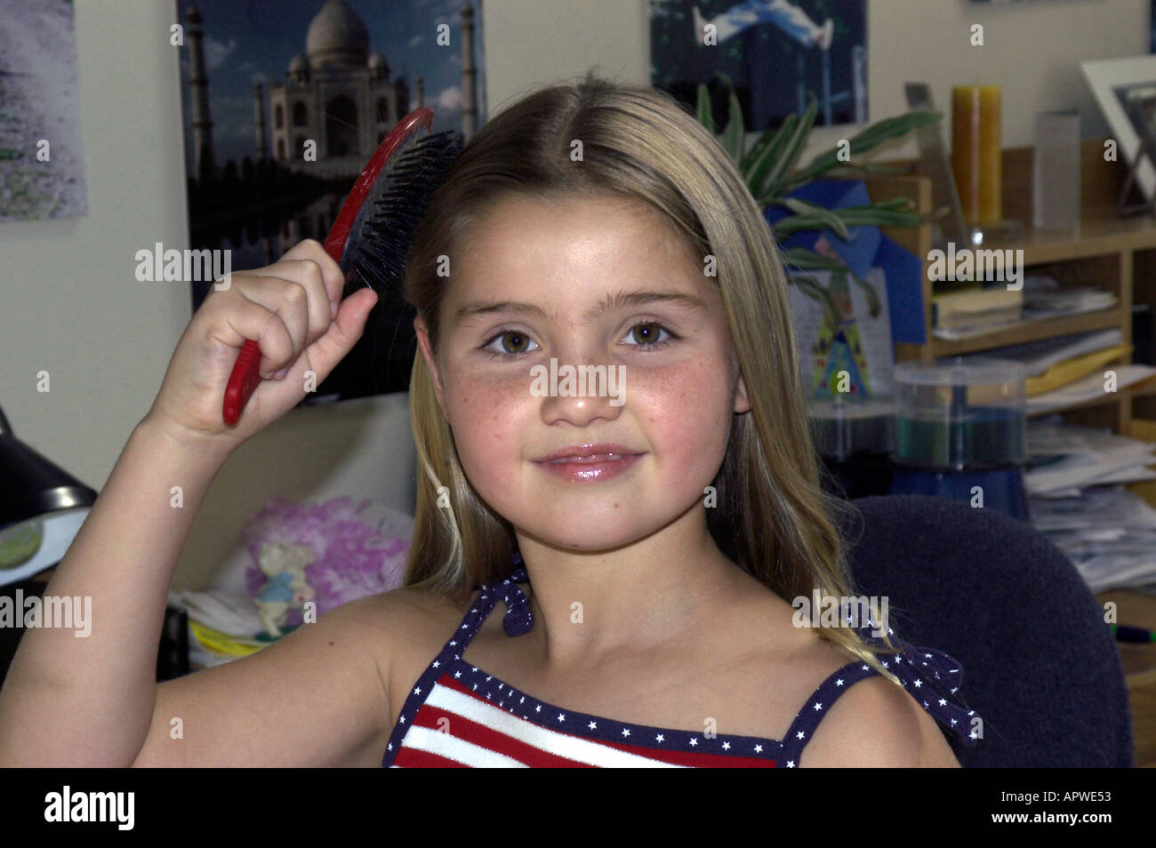 girl combing hair Stock Photo - Alamy