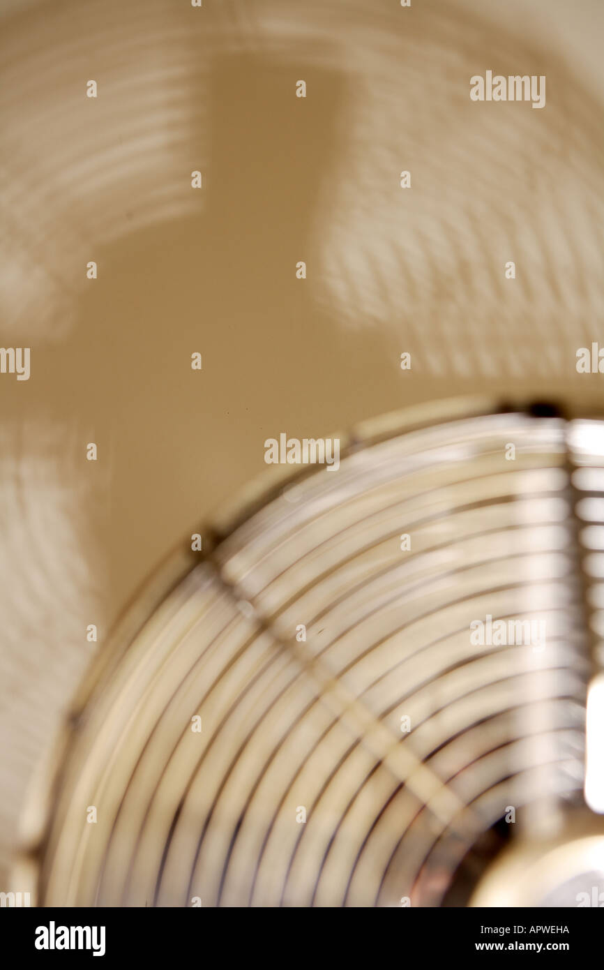Retro electrical fan with shadow on wall Stock Photo - Alamy