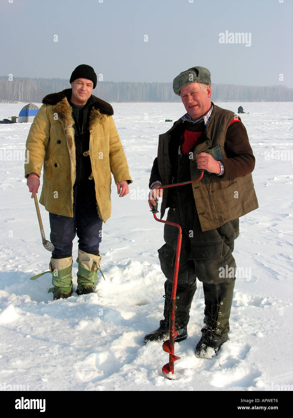 Ice fishing in Ural Mountains Russia Stock Photo - Alamy