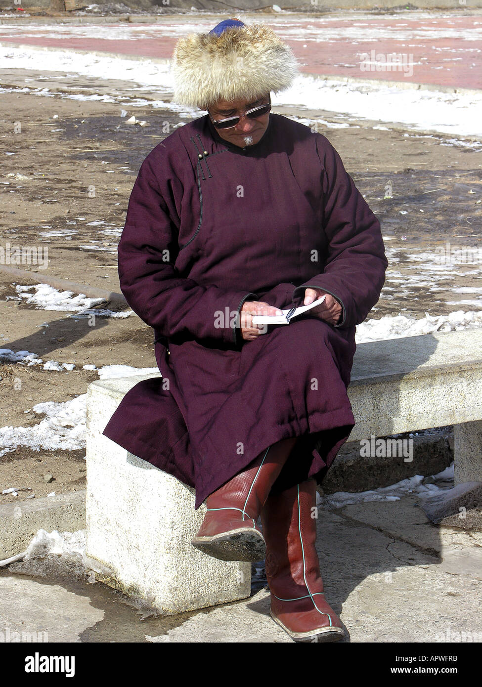 Man in traditinoal costume at Gandantegchinlen Khiid Monastery Ulaan ...