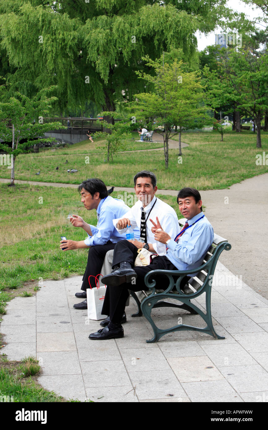 Group of businessmen on a bench in Nakajima Park Sapporo Japan Stock ...