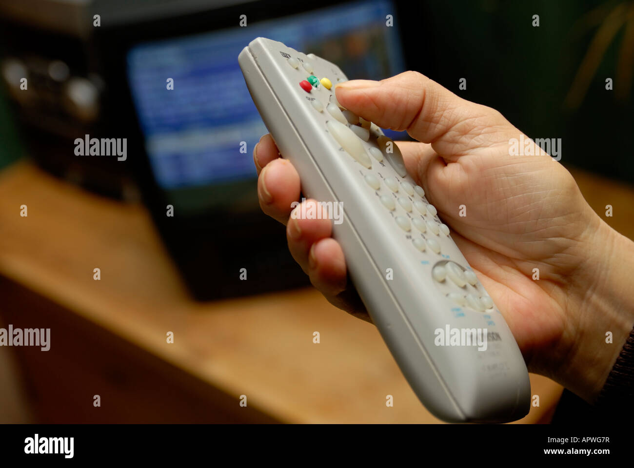 Using a remote control to change television channels Stock Photo - Alamy