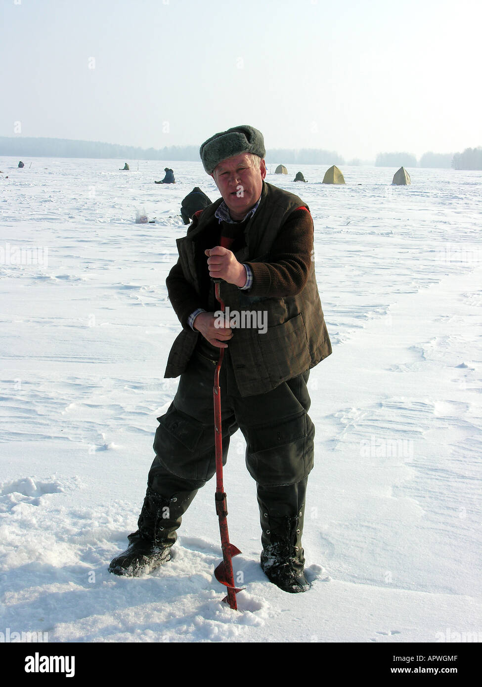 Ice fishing in Ural Mountains Russia Stock Photo - Alamy