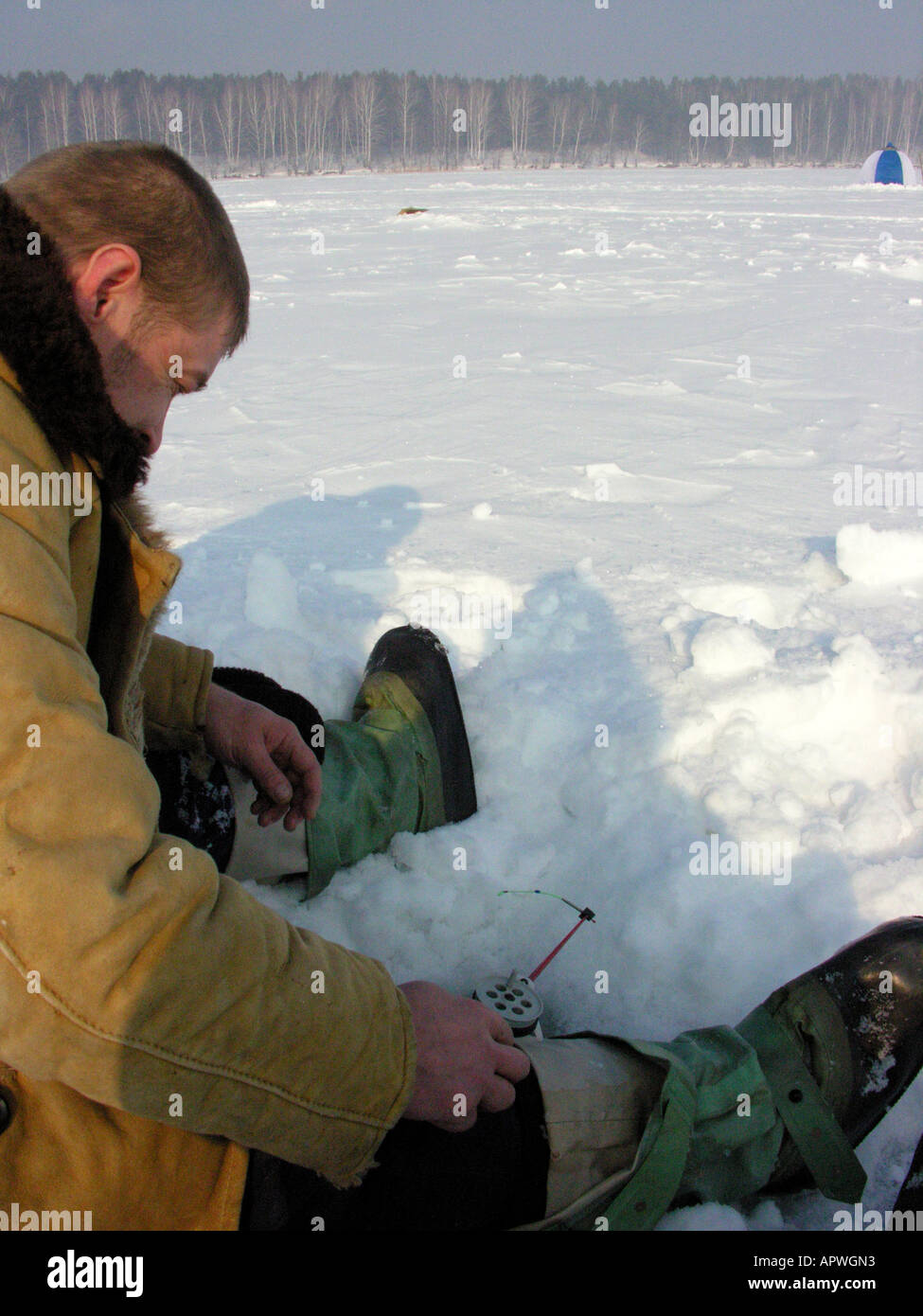 Ice fishing in Ural Mountains Russia Stock Photo - Alamy
