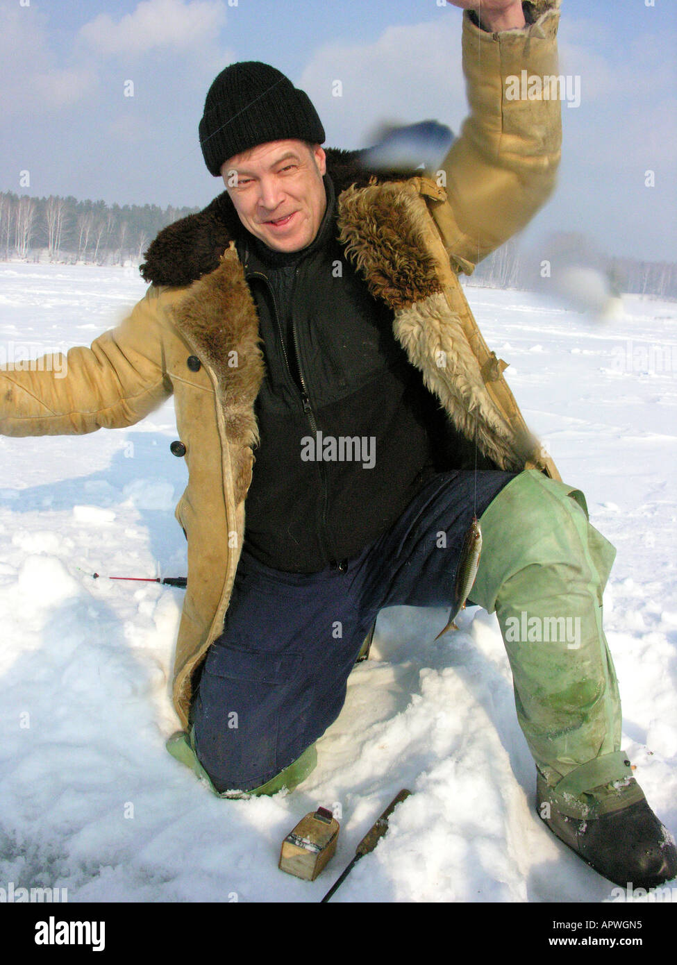 Ice fishing in Ural Mountains Russia Stock Photo - Alamy