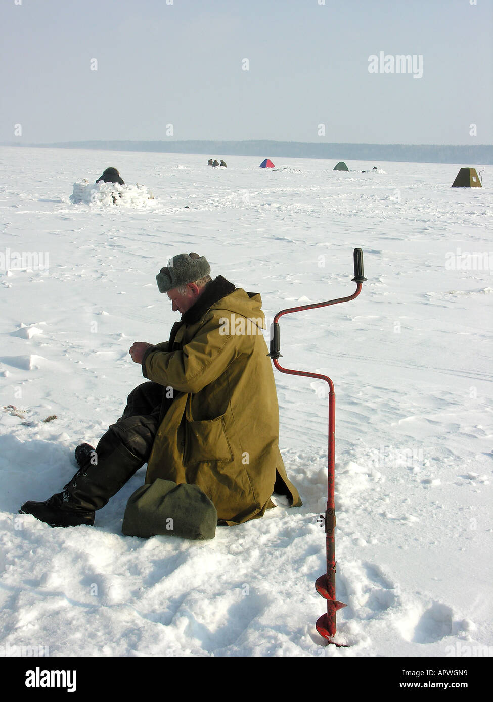 Ice fishing in Ural Mountains Russia Stock Photo - Alamy