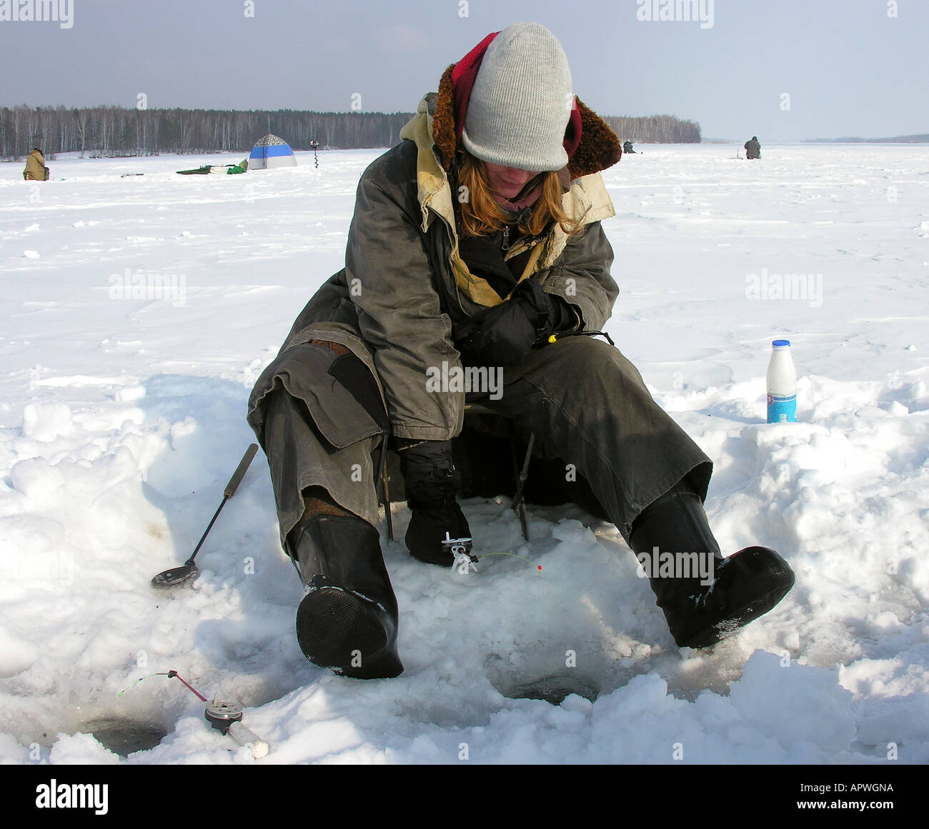 Ice fishing in Ural Mountains Russia Stock Photo - Alamy