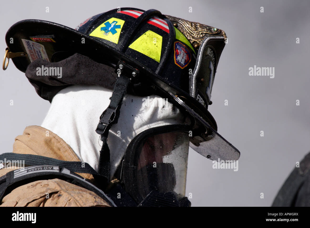 An American Firefighter full of dirt and debris while working to ...