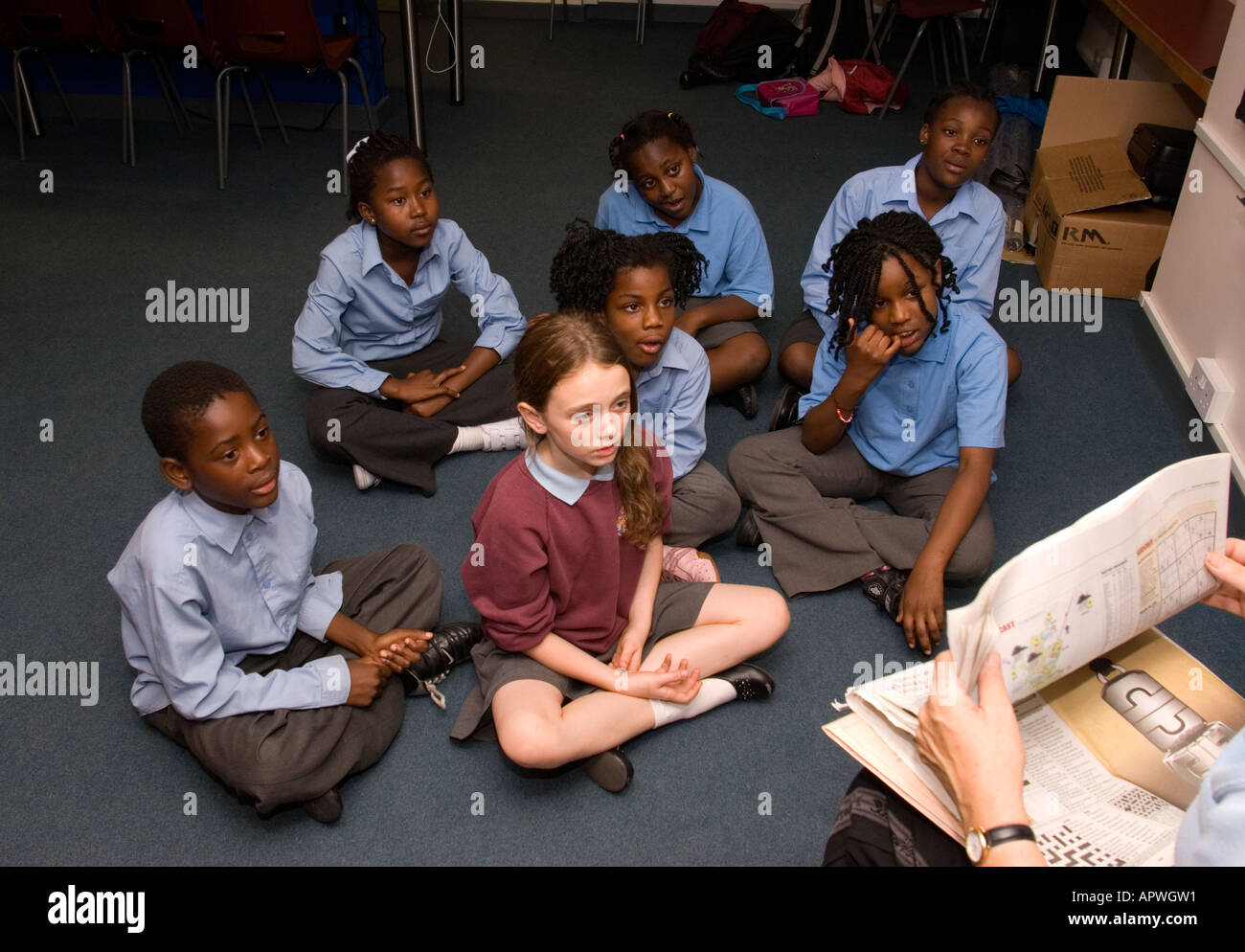 Primary school children attending newspaper group at after school club ... Primary school children attending newspaper group at after school club ...
