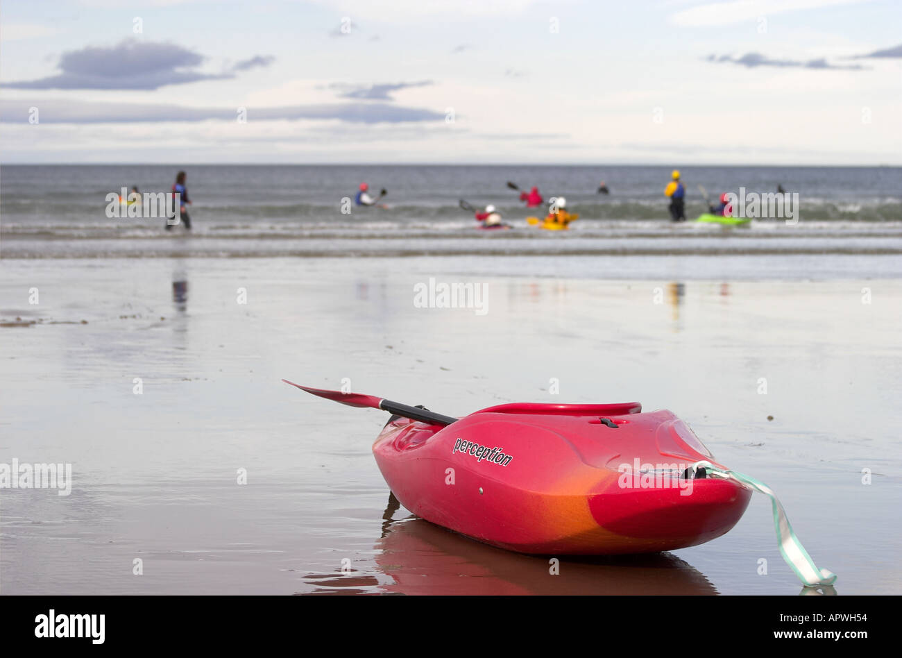 Red Perception Kayak on beach Moray Firth Scotland Stock Photo - Alamy
