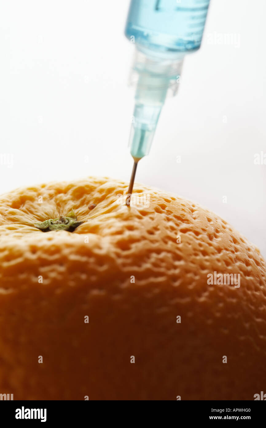 Syringe Injecting Orange Fruit High Resolution Stock Photography and ...