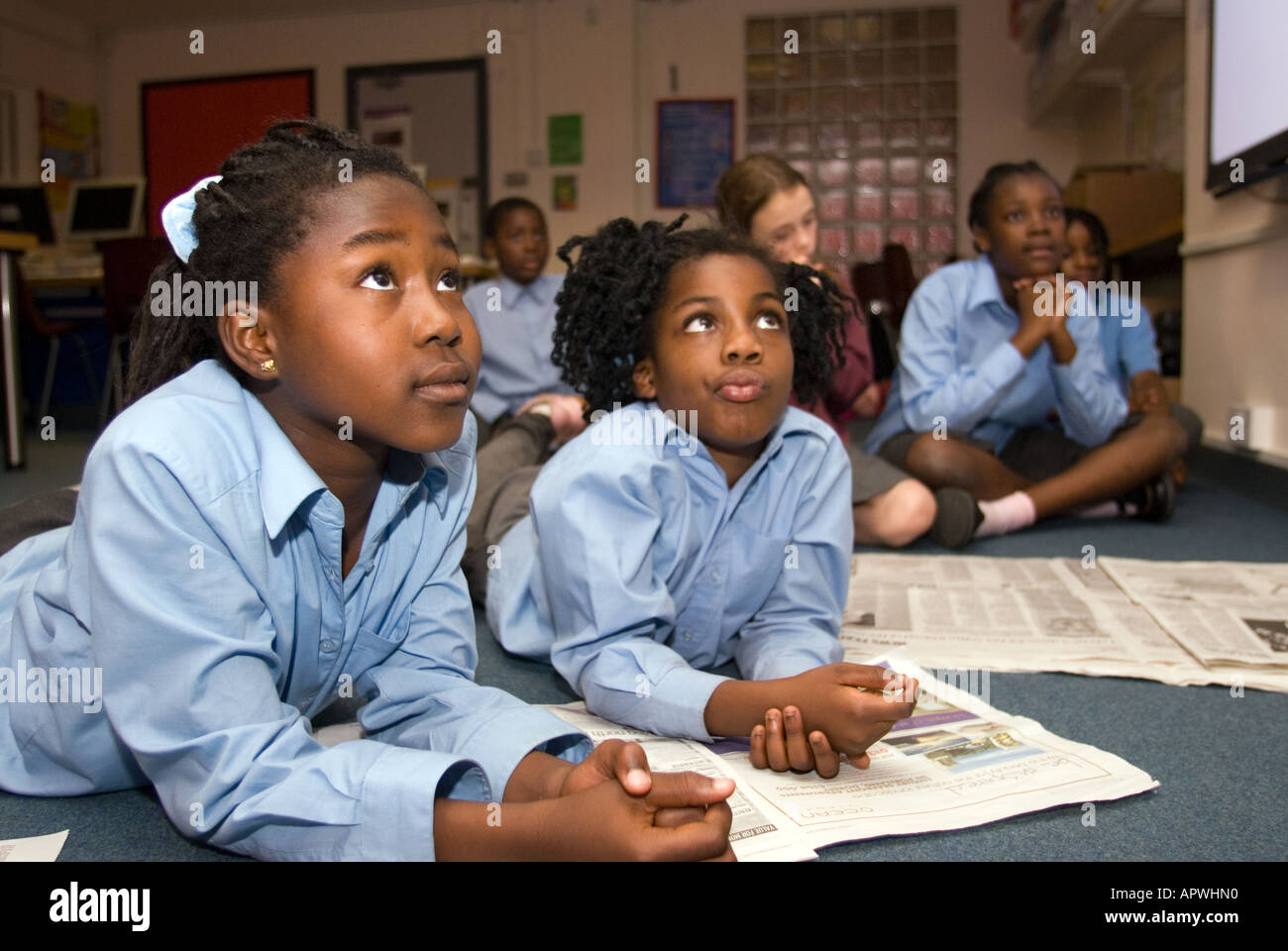 Primary school children attending newspaper debating group at after ...