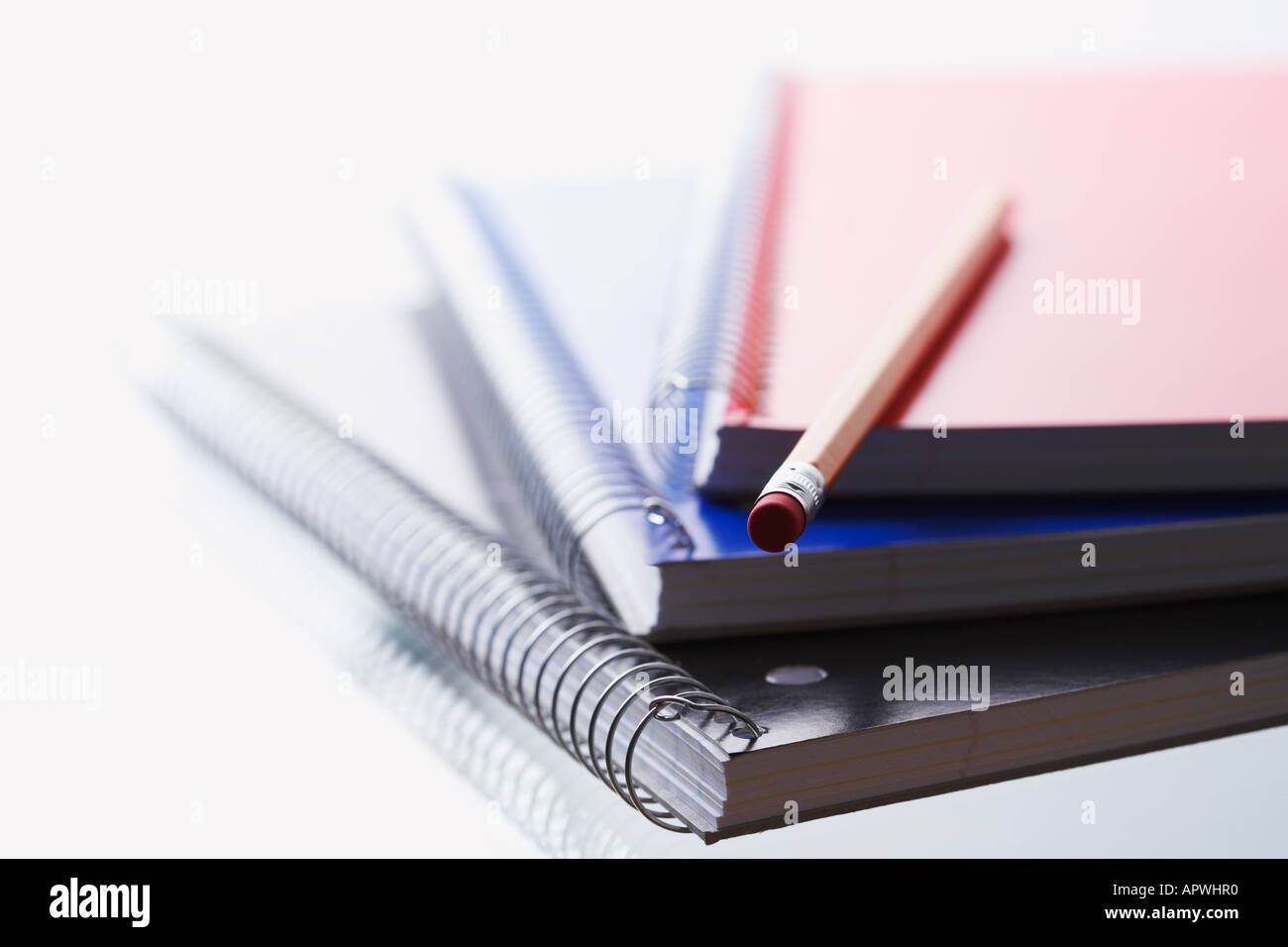 Notebooks and pencil Stock Photo - Alamy