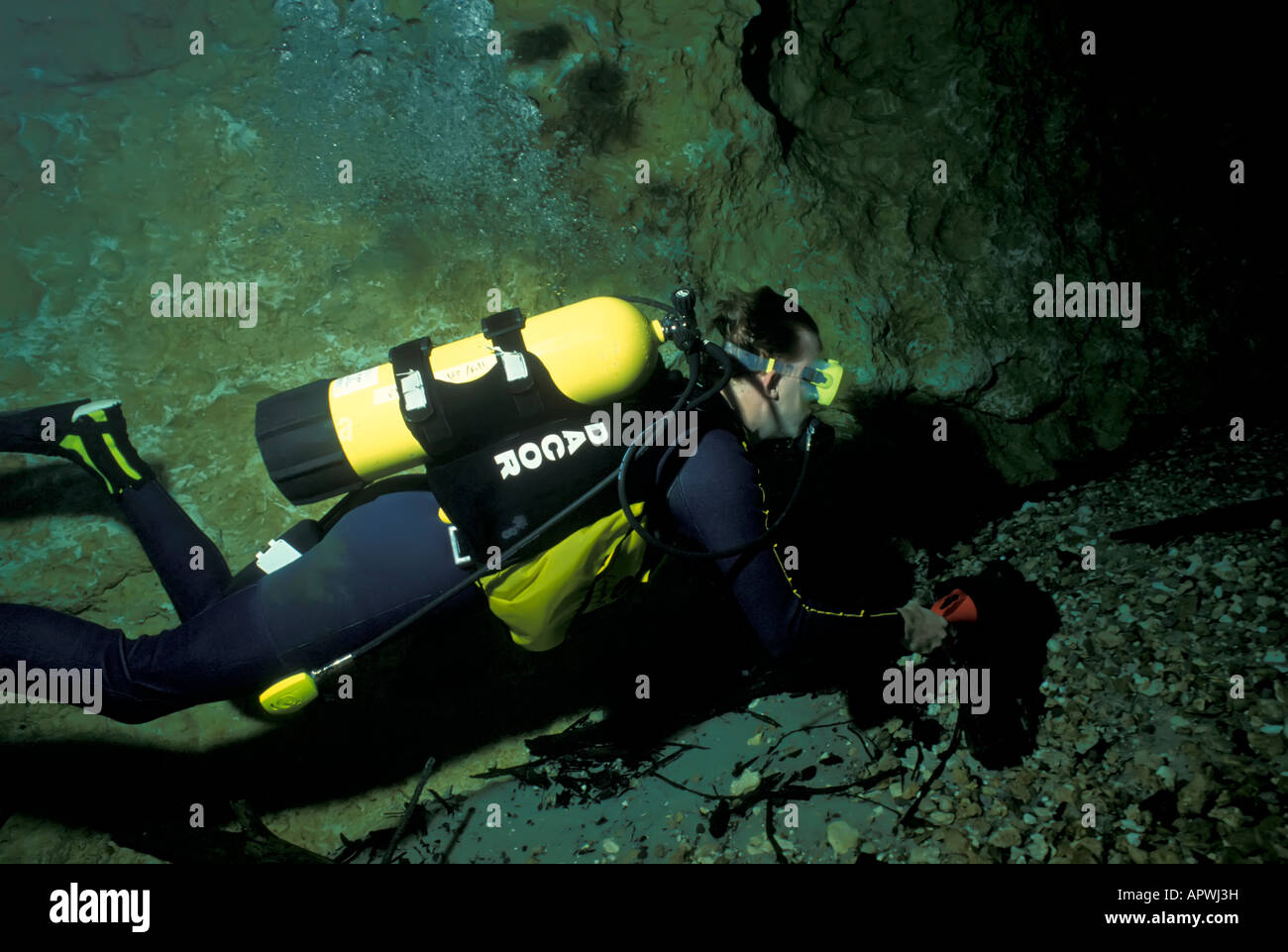 diver underwater cave tunnel Florida fresh water spring diving Madison ...