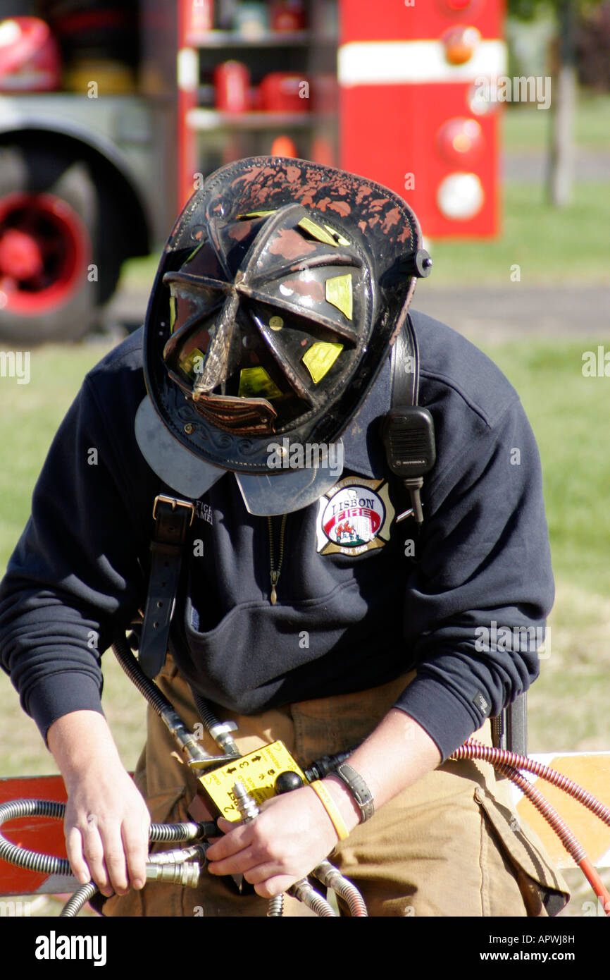 A firefighter working the hydraulic controls that are being used by the ...