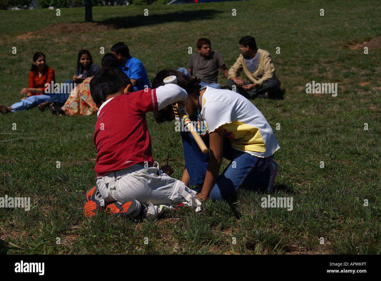 Children playing with stick Stock Photo - Alamy