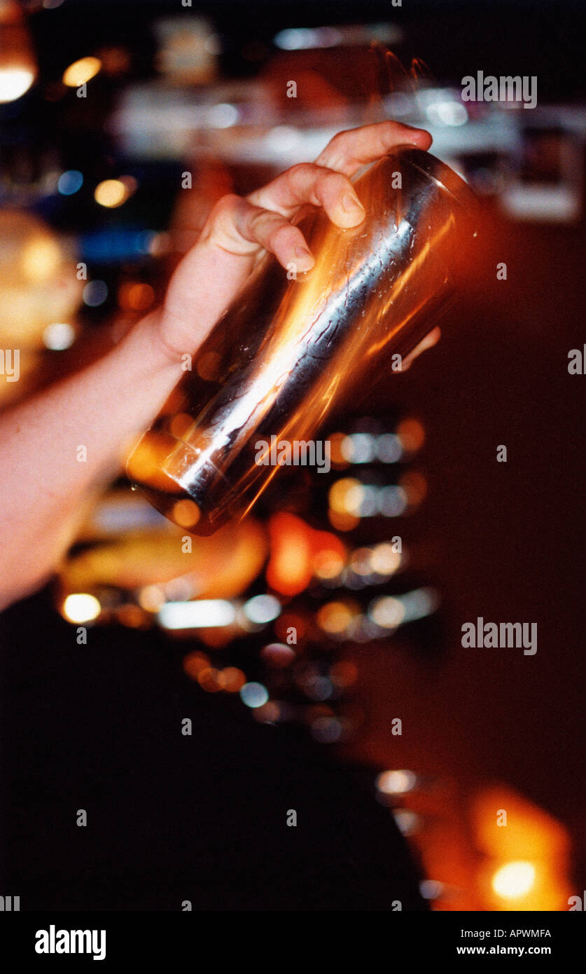 Bartender holding cocktail shaker Stock Photo - Alamy