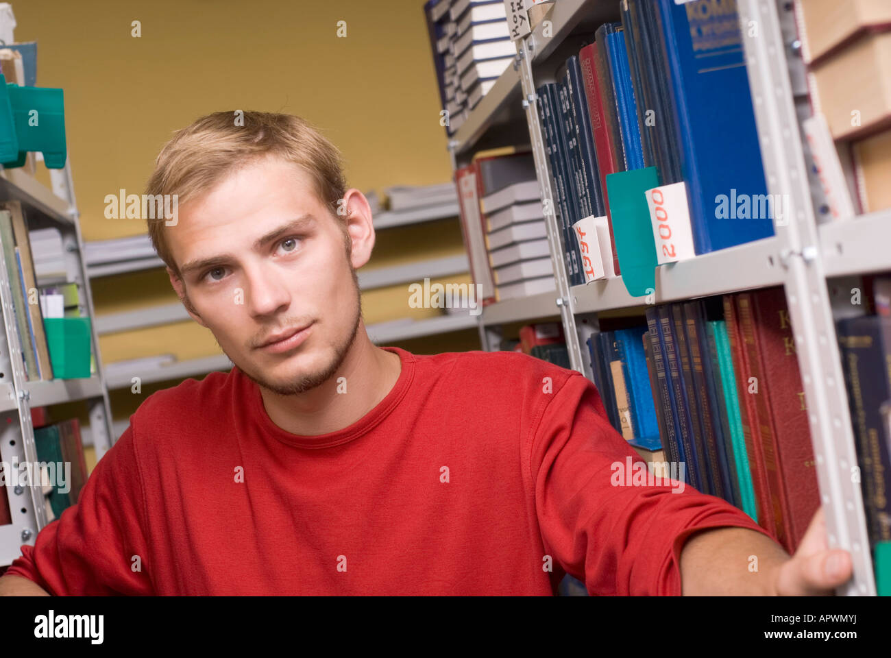 portrait of young student in school library Stock Photo - Alamy
