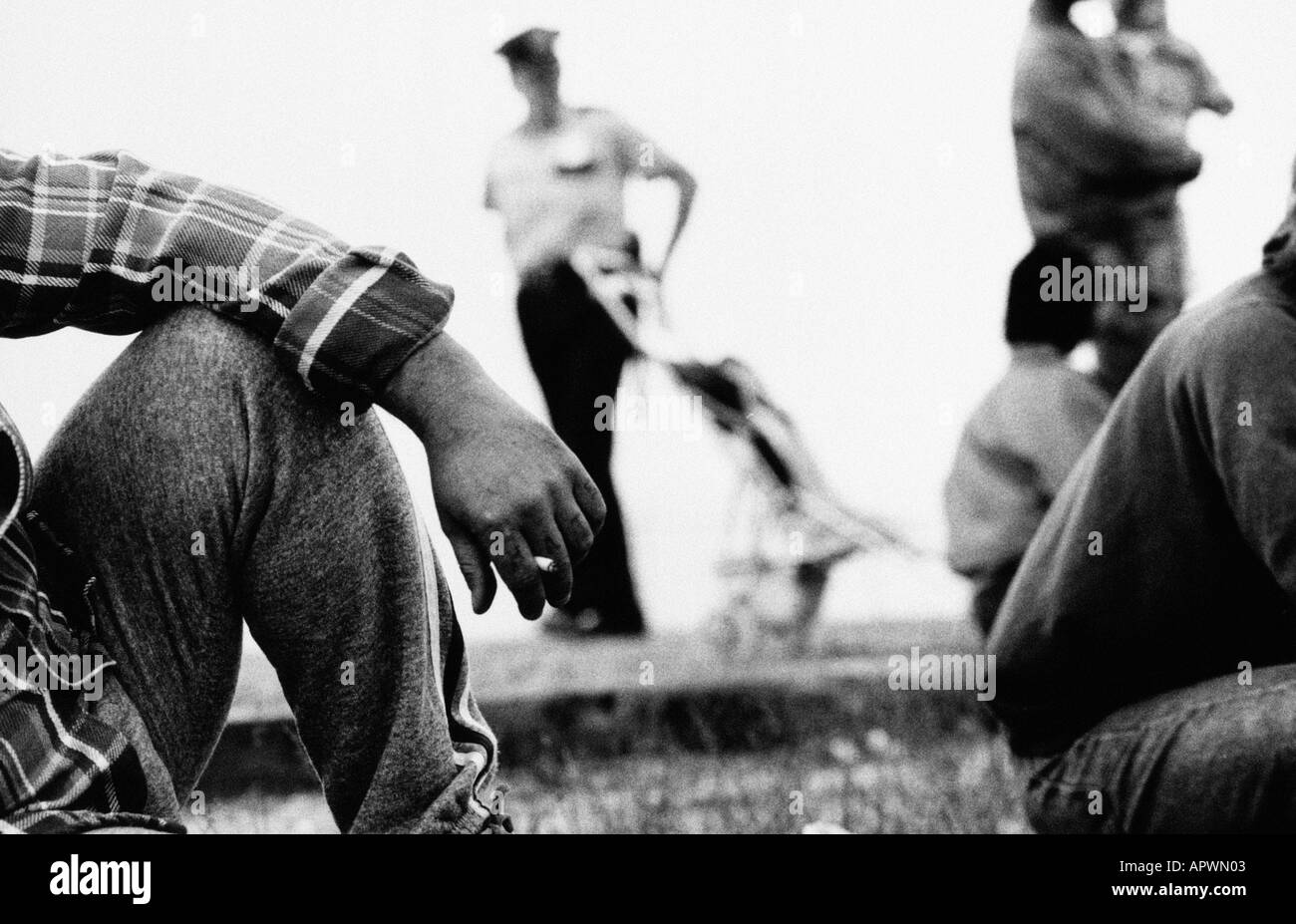 Small group of people sitting Black and White Stock Photos & Images - Alamy