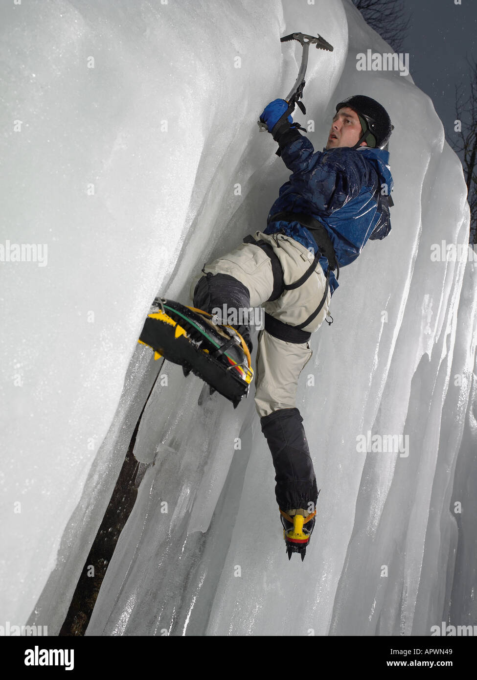 Man ice climbing Stock Photo - Alamy