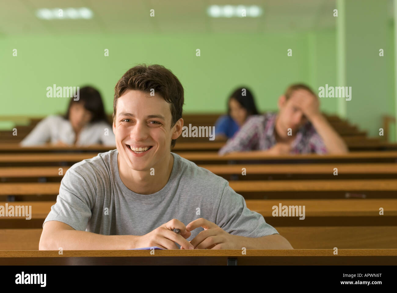 portrait of smiling male student in lecture hall Stock Photo - Alamy