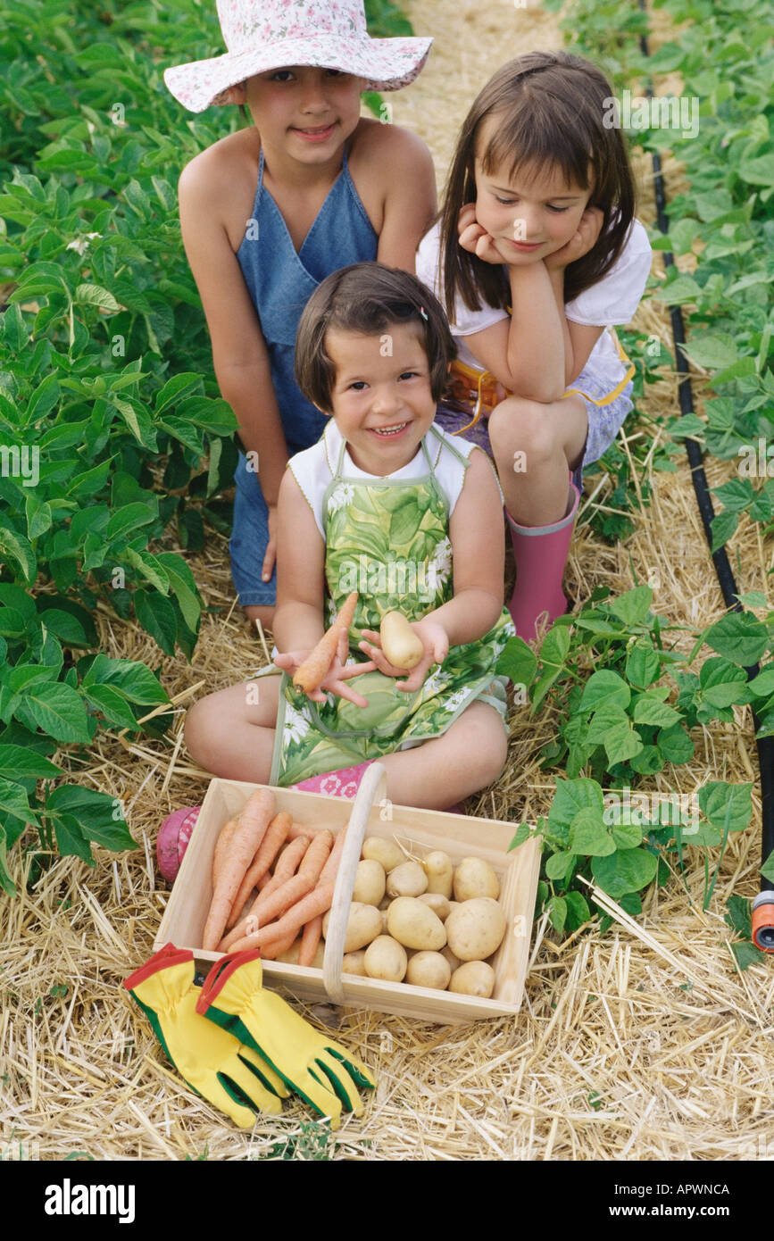 Girls with a basket of vegetables Stock Photo - Alamy