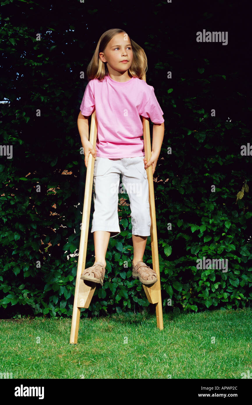 Girl on stilts Stock Photo - Alamy