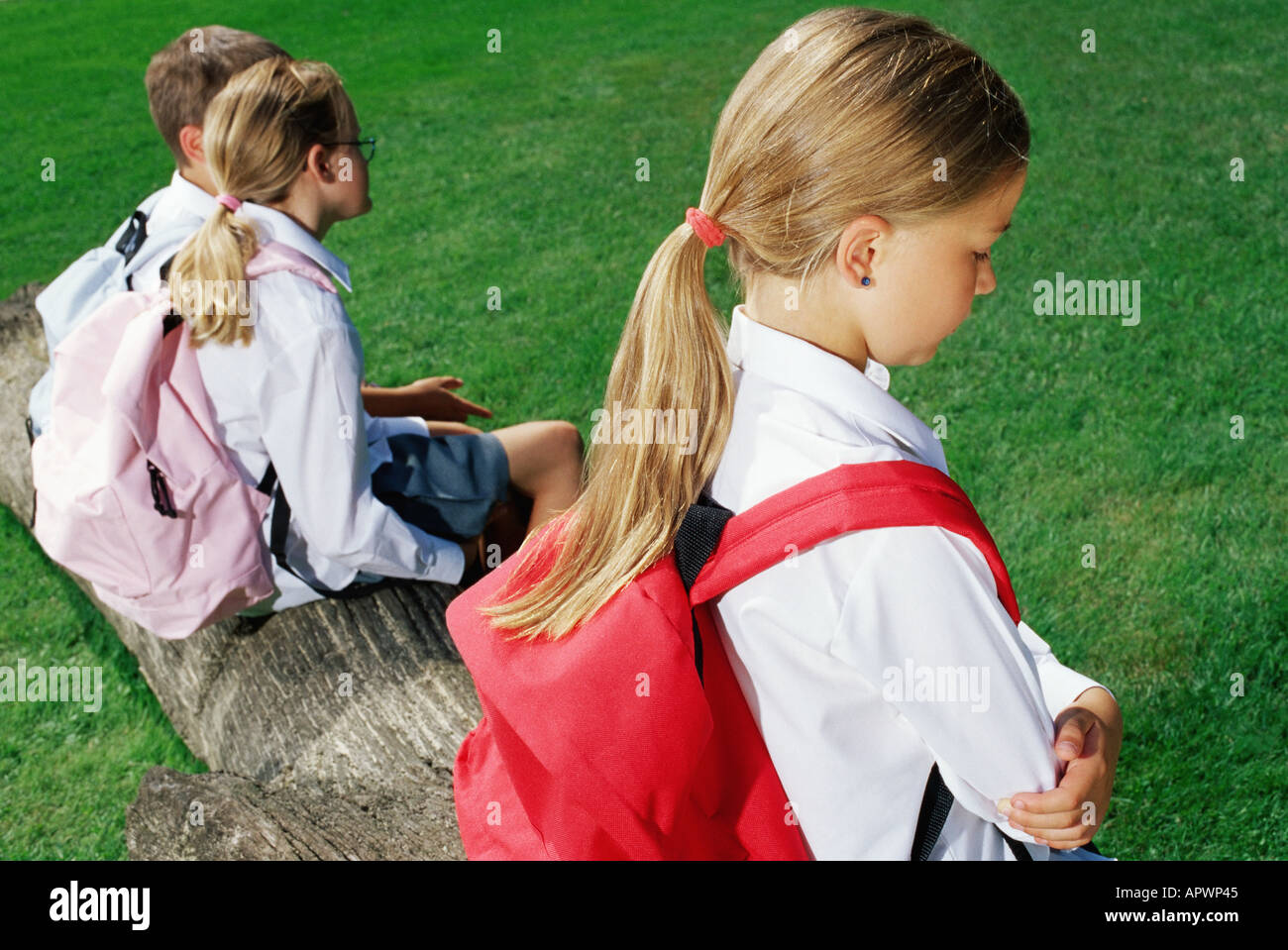 Girl separate from other children Stock Photo - Alamy