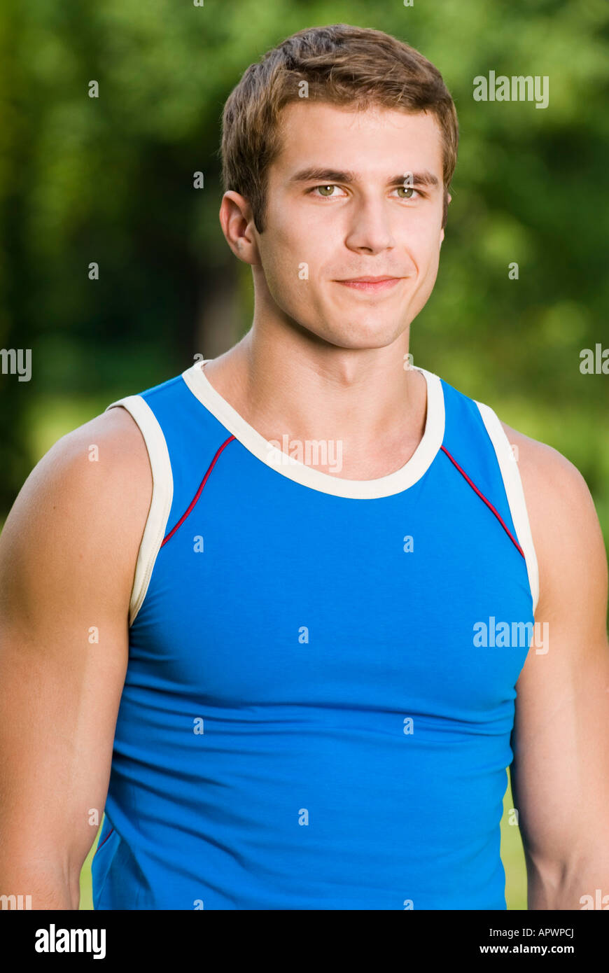 portrait of young man in blue sportswear Stock Photo - Alamy