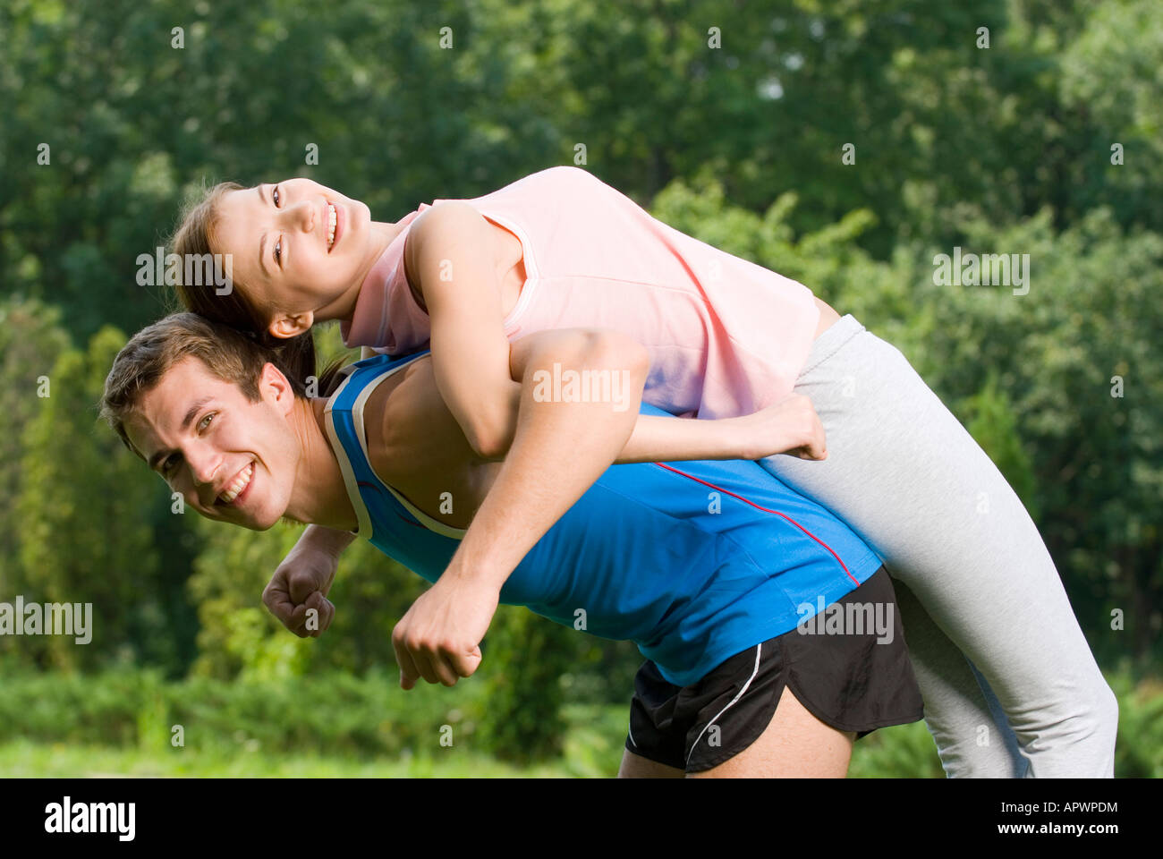 portrait of young couple doing fitness exercises together Stock Photo ...
