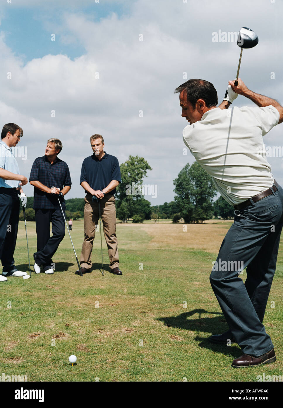 Men playing golf Stock Photo - Alamy