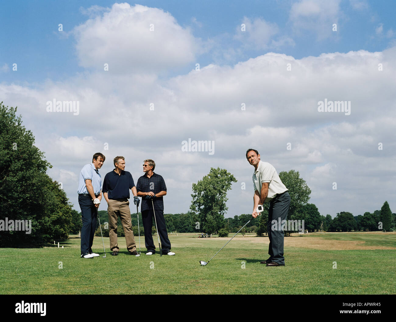 Men playing golf Stock Photo - Alamy