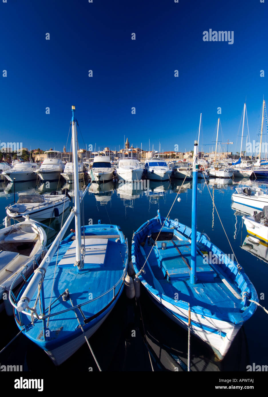 Small blue sailing boats at harbour in Alghero Sardinia Italy 2007 ...