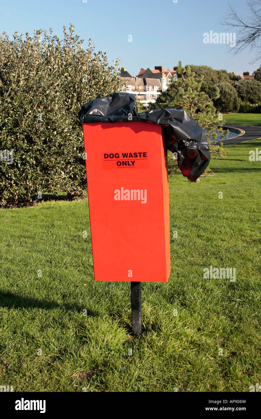 Red public dog waste bin Stock Photo - Alamy