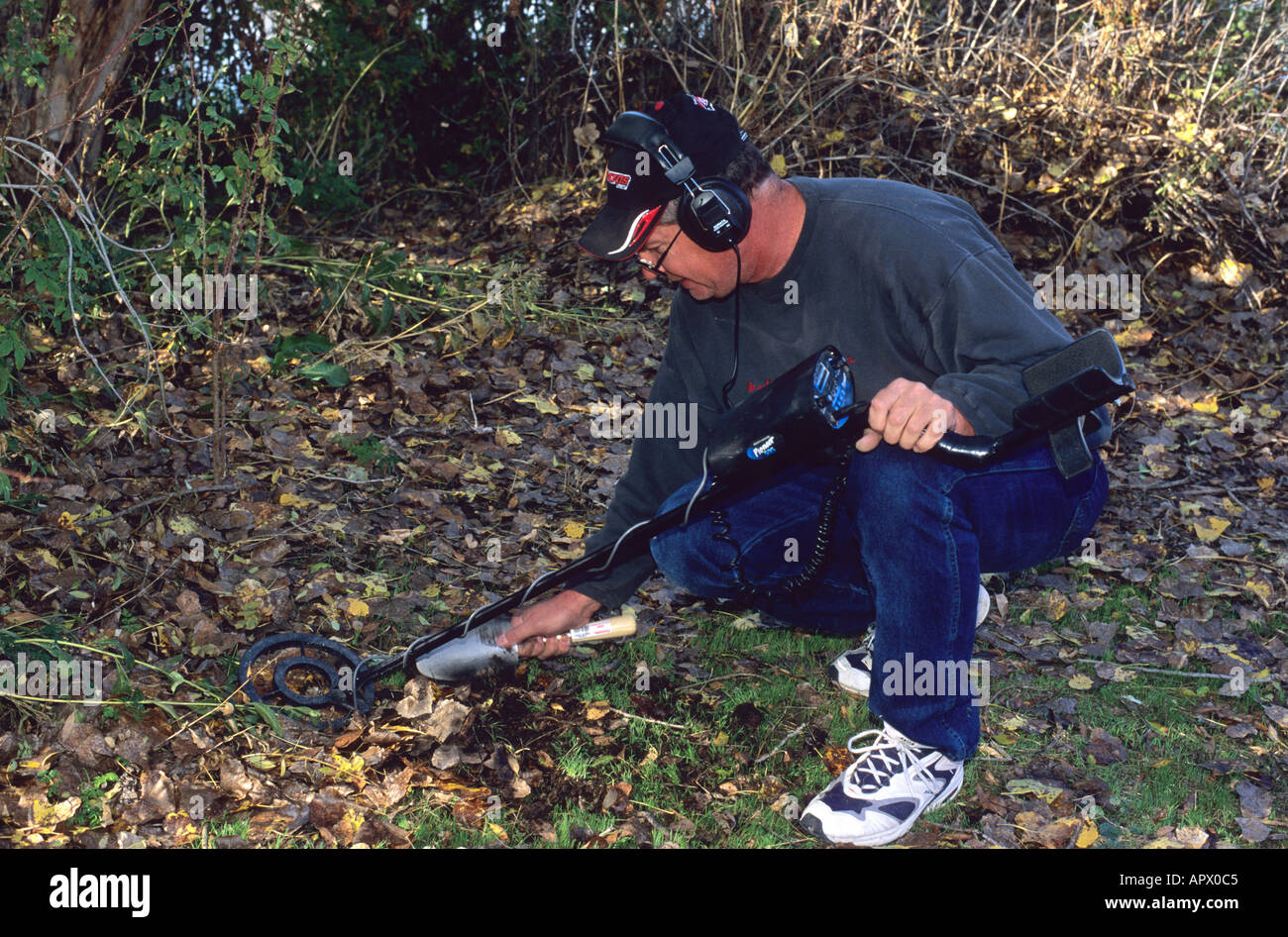 Man using a metal detector Stock Photo - Alamy