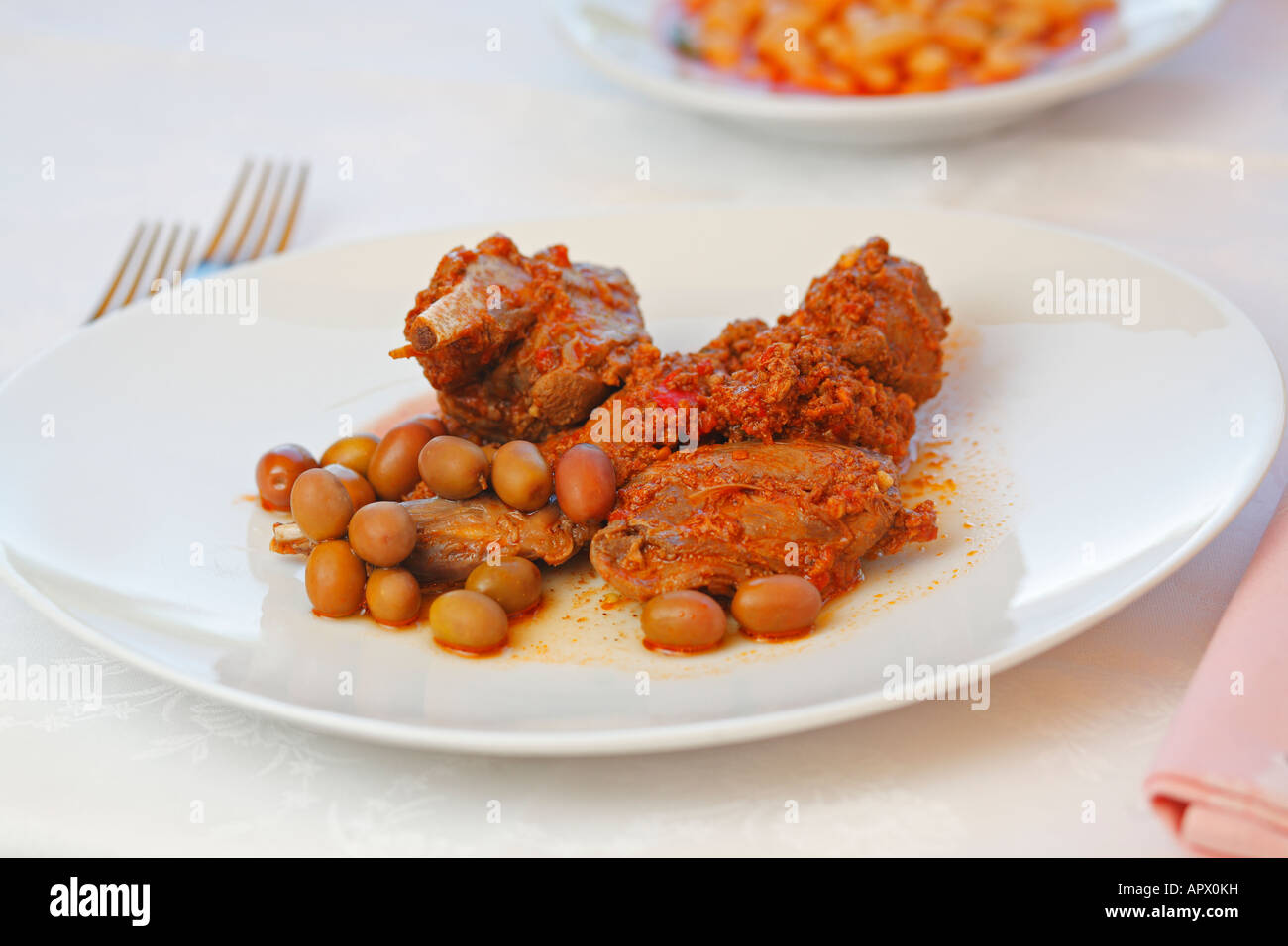 Rabbit stew with olives, Tuscan restaurant, Italy Stock Photo - Alamy