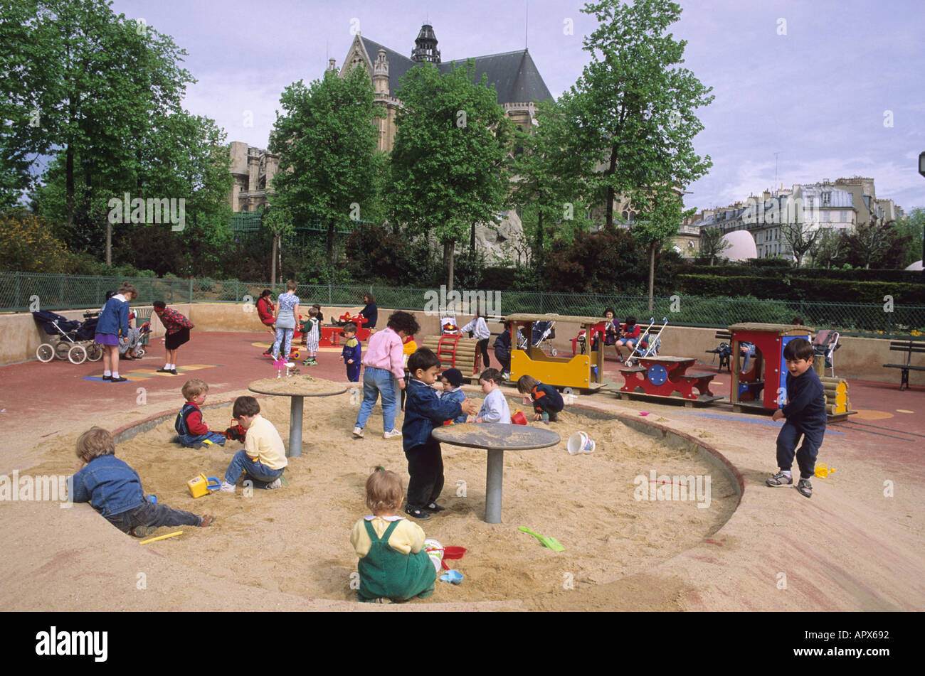 French children attend preschool and play outside on the playground in ...